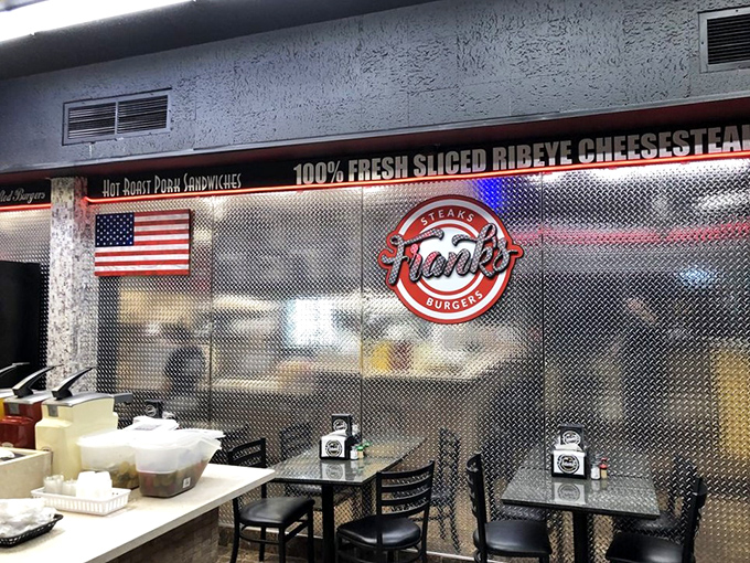 Industrial chic meets comfort food haven. The metallic walls and American flag create the perfect no-nonsense backdrop for serious eating.