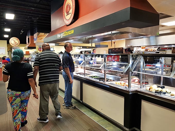 The pilgrimage to the Grill House—where patient patrons await their turn for flame-kissed treasures that make the journey worthwhile.