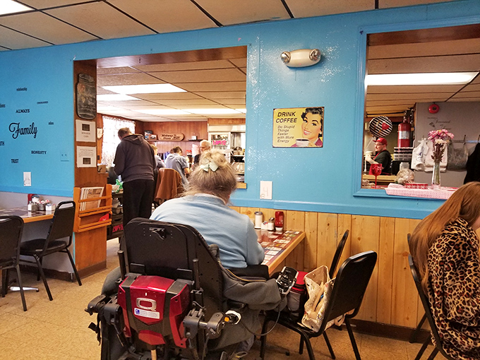 Blue walls, wood paneling, and that vintage coffee sign—stepping into Midway is like time-traveling to when conversation trumped cell phones.