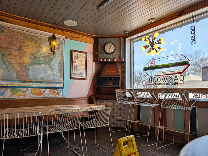 Mid-century modern meets burger joint nirvana. The vintage map on the wall isn't just decor—it's plotting your journey to flavor country while those wire chairs somehow make waiting for your burger an exercise in style.