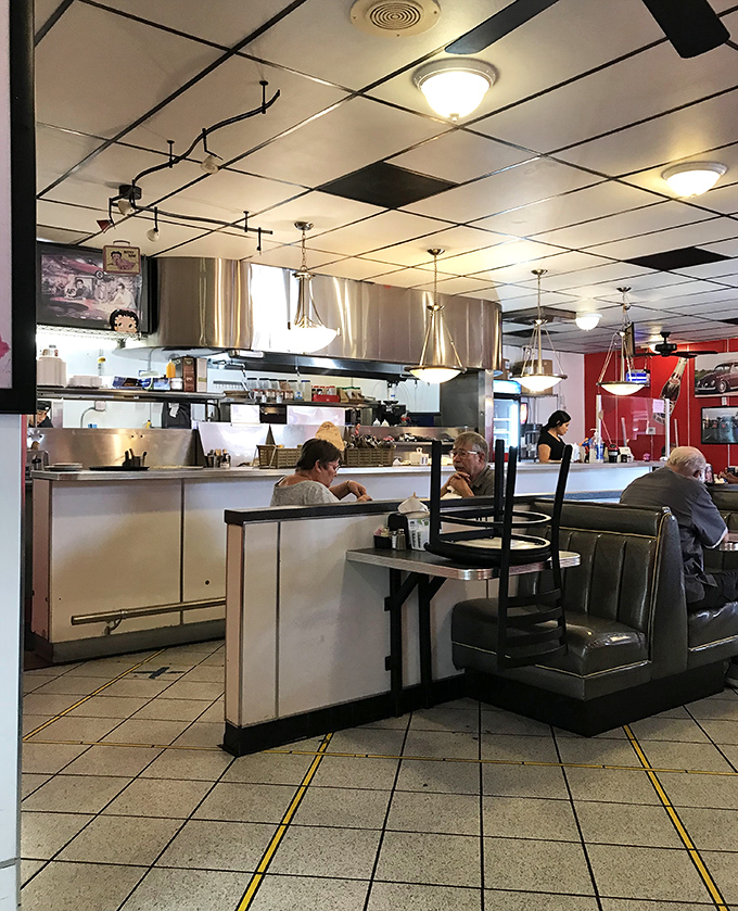 Classic diner perfection: counter seating that puts you front-row for the culinary theater, where breakfast symphonies are composed all day long.