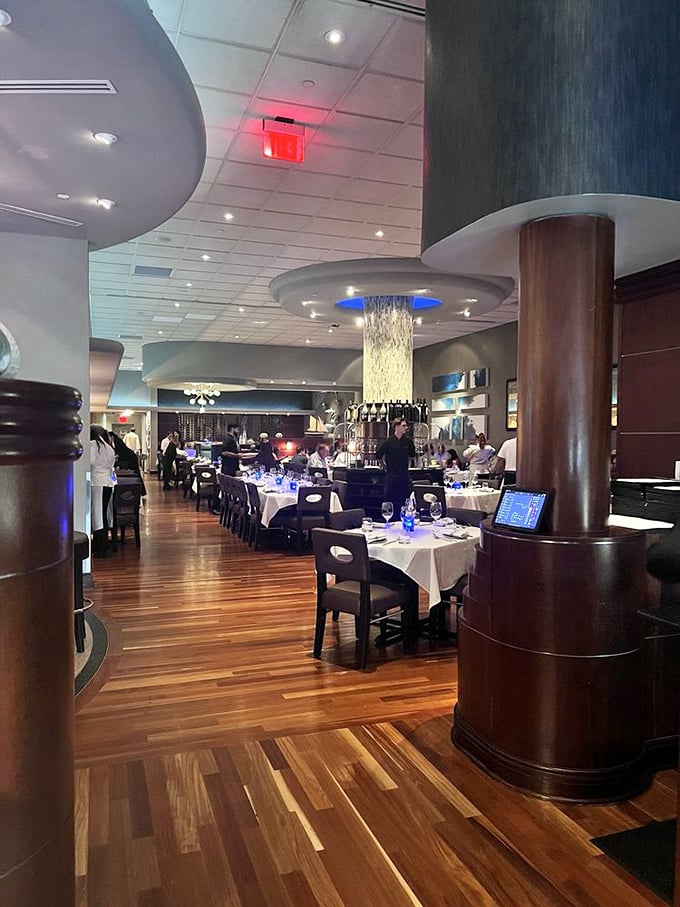 Step inside and you're transported to a luxury ocean liner's dining room—polished wood, elegant columns, and not a plastic lobster bib in sight.