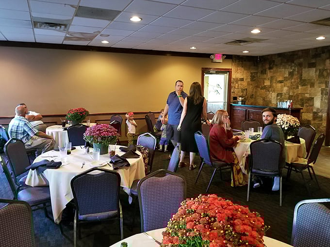 Inside, white tablecloths meet vibrant floral arrangements, creating that perfect sweet spot between "special occasion" and "comfortable enough to actually enjoy yourself."