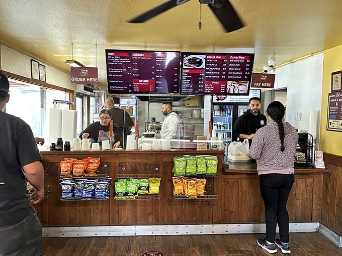 Where barbecue dreams come true! The ordering counter at Best Bar-BQ offers a front-row view to smoky paradise and chip selection worthy of a championship bracket.