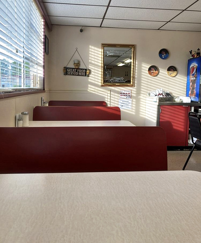 
Red vinyl booths and a "GREAT FOOD SERVED HERE" sign that isn't lying. This isn't Instagram-bait decor—it's the authentic stage where comfort food memories are made. 