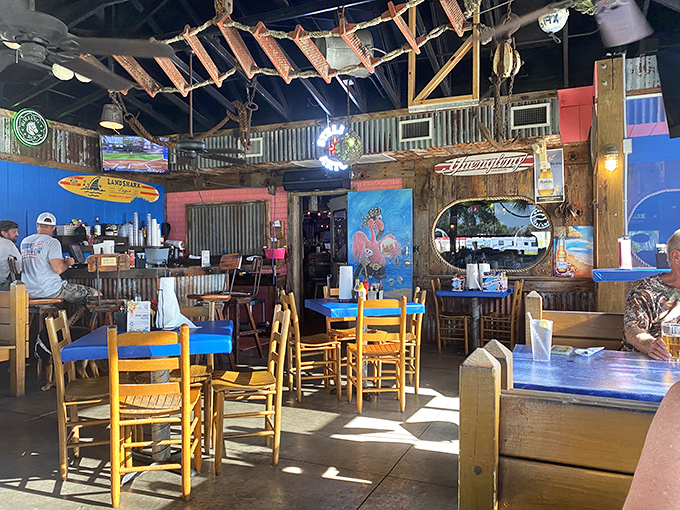 Rustic wooden beams, blue-cushioned chairs, and sunlight streaming through windows—this isn't interior design, it's Florida comfort perfected.