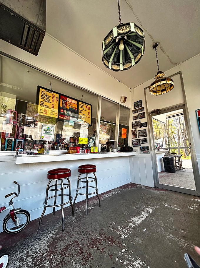 Vintage pendant lights and classic bar stools transport you to simpler times. This isn't Instagram-bait design—it's authentic Americana that's earned its patina.