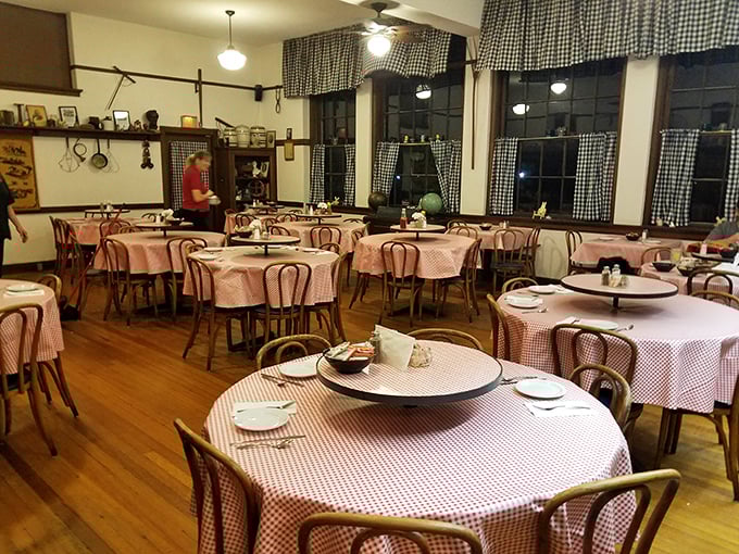 Red checkered tablecloths and vintage school memorabilia create the perfect nostalgic atmosphere for an unforgettable family dining experience.