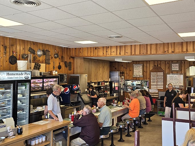 Where wood-paneled walls tell stories and counter seats offer front-row tickets to the greatest show on earth: homestyle cooking performed without pretense.