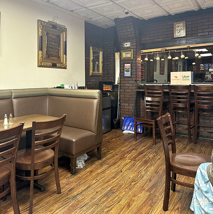 Cozy booths and simple décor tell you immediately: this place invested in the kitchen, not interior designers. Smart move.