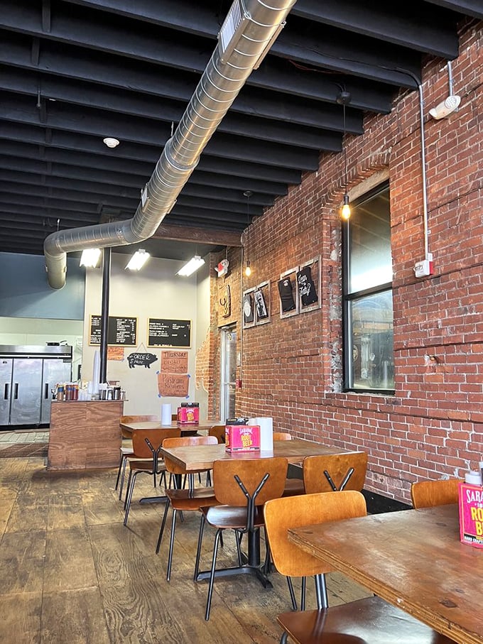 Industrial-chic meets barbecue simplicity with exposed brick walls, wooden tables, and that all-important ventilation system that's seen some serious smoke action.