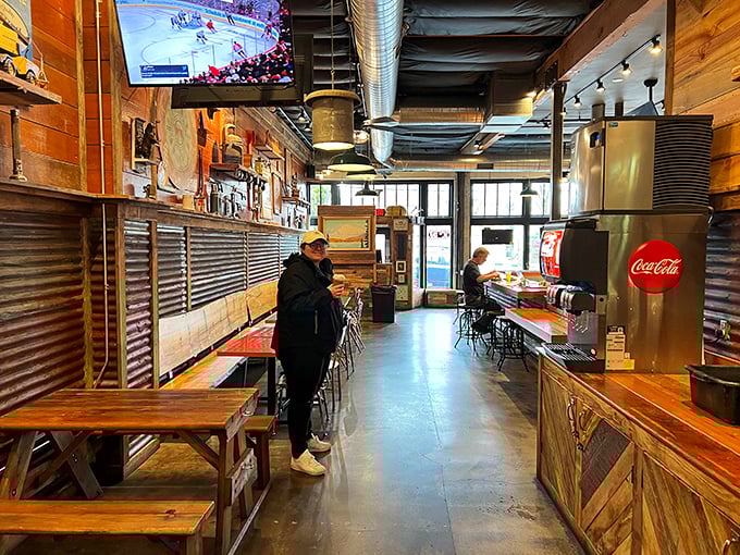 Inside, rustic wood meets industrial chic in a space that feels like your coolest friend's garage—if that friend happened to be a chicken-smoking genius.