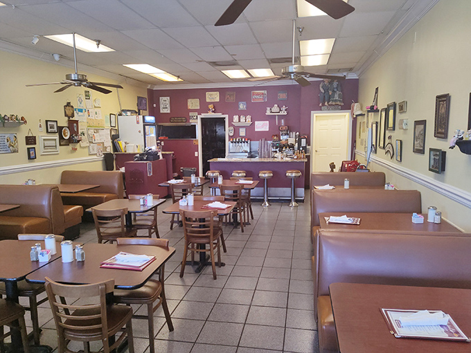 Inside, burgundy walls and ceiling fans create that perfect "grandma's dining room" vibe—the universal signal that incredible comfort food awaits.