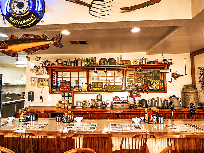 Step inside this treasure trove where vintage collectibles and fishing memorabilia create the perfect backdrop for comfort food.