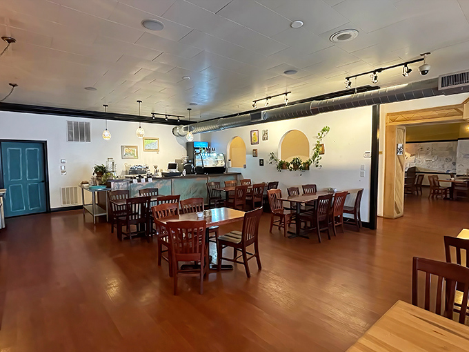 Warm wooden floors, pendant lighting, and that signature turquoise door create a space that feels like the living room of your coolest, most culinarily-gifted friend.