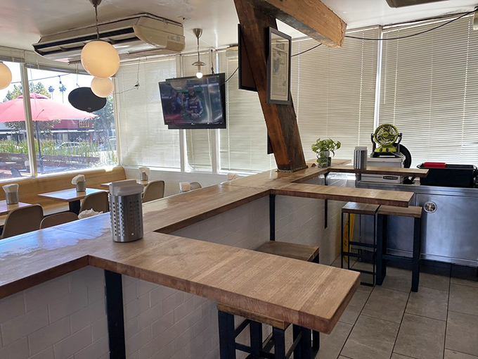 Minimalist wooden counters and simple seating create the perfect backdrop for food that's anything but simple. Comfort meets craftsmanship in this thoughtful space.