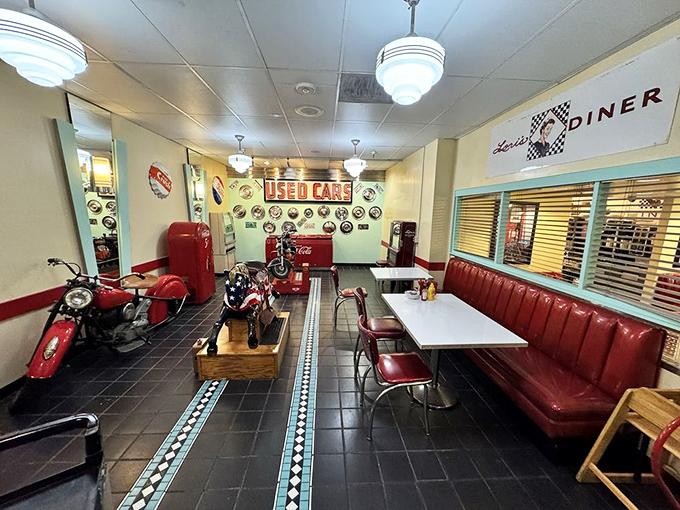 Step inside and you're transported to the 1950s—complete with vintage motorcycles, cherry-red booths, and enough chrome to blind a time traveler.