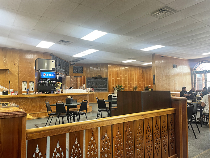 Wood paneling and simple furnishings set the stage for culinary drama. No Instagram filters needed when the food does all the talking.