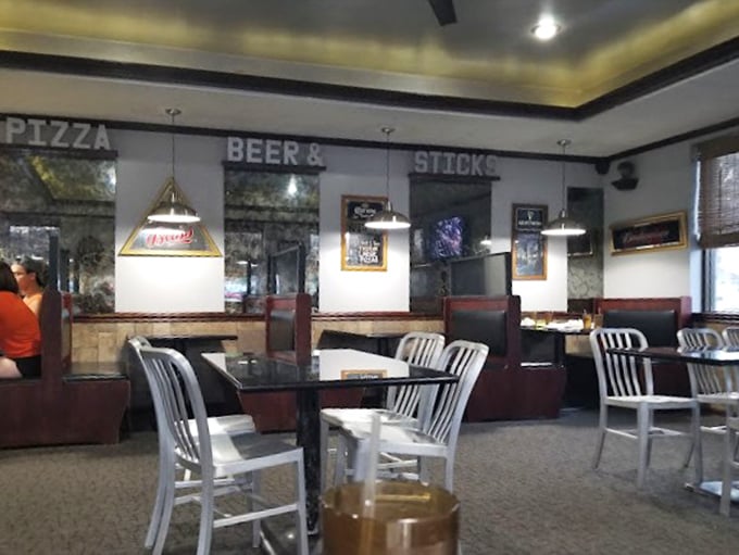 "Pizza, Beer & Sticks" isn't just signage—it's a sacred promise this cozy dining room has kept faithfully to Bowling Green residents and students alike.