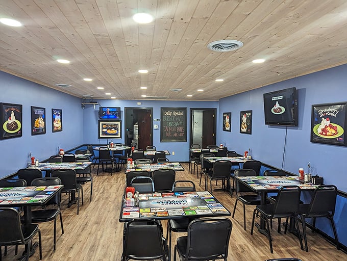 Blue walls, wooden ceiling, and food posters that serve as both decoration and appetite stimulants. This dining room has witnessed countless "first bite" face journeys.