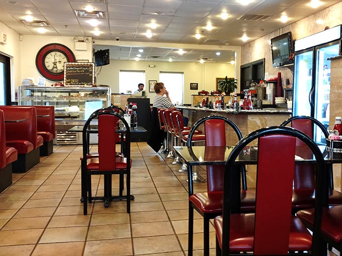 Classic red vinyl meets timeless diner design. This isn't retro chic—it's the real deal that chain restaurants spend millions trying to replicate.