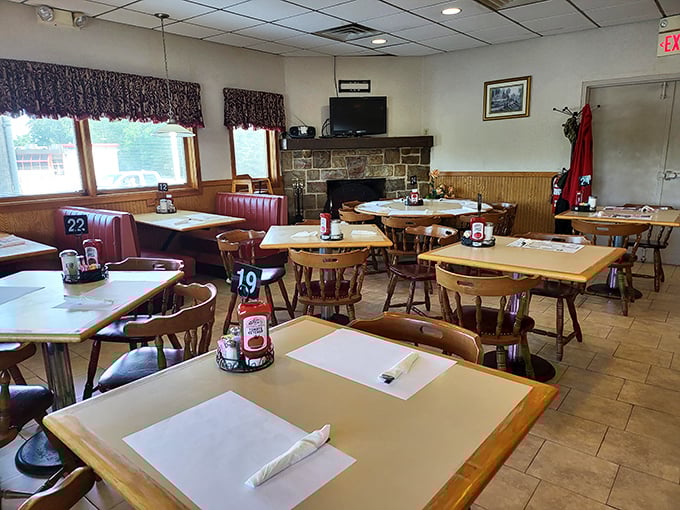 Classic diner aesthetics with wood paneling and red vinyl booths create that "I've come home" feeling—minus your uncle's political opinions at the dinner table.