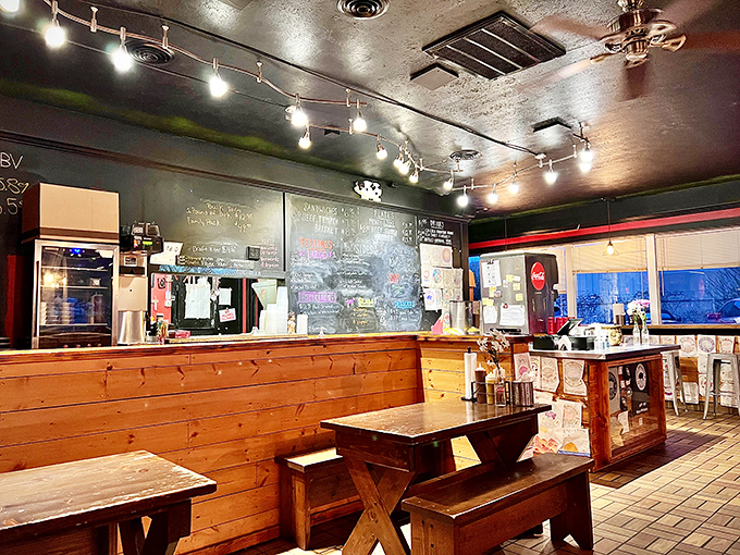 Inside, rustic wooden tables and benches create an unpretentious atmosphere where the only thing that matters is what's on your plate—and how quickly you can devour it.