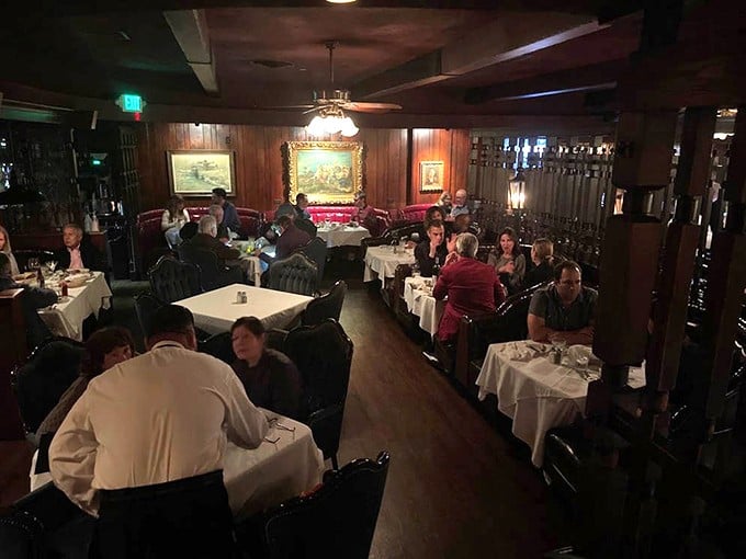 Step inside and time stands still – dark wood paneling, white tablecloths, and conversations that don't involve asking for the Wi-Fi password.