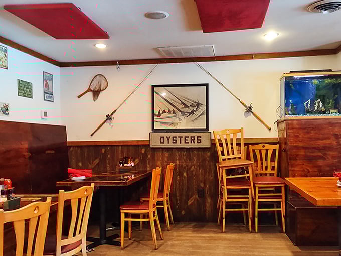 Fishing rods and nautical decor transform this cozy dining room into a sea captain's quarters. The "OYSTERS" sign isn't just decoration—it's a delicious promise.