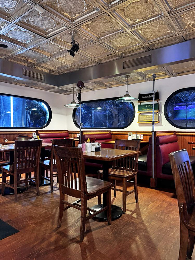 Step inside and you're transported to a classic diner with a Hollywood twist—porthole windows, pressed tin ceilings, and burgundy booths create the perfect scene.