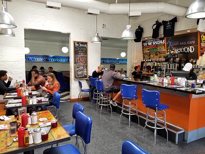 Where blue vinyl meets orange countertops in a symphony of retro cool. This isn't just a diner; it's a time machine with better coffee.