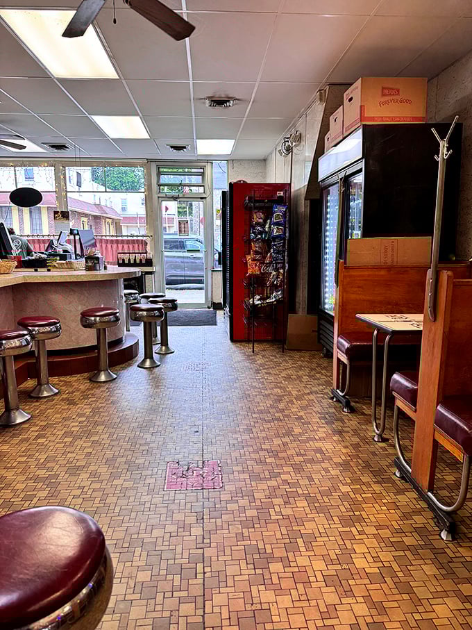 The classic diner interior at Lou's feels like stepping into a time capsule. Those vintage counter stools have supported generations of happy eaters.