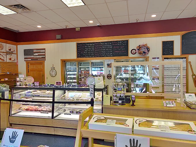 Step inside and behold pie headquarters—where cream, fruit, and custard dreams come true beneath chalkboard menus and patriotic decor.