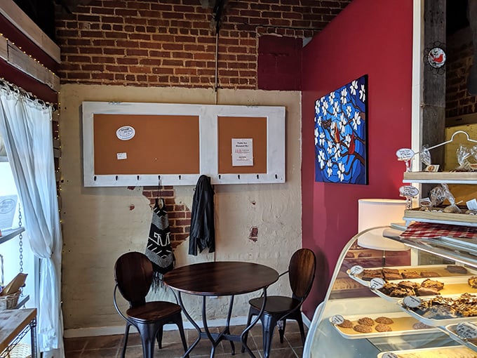 Exposed brick walls and simple wooden tables create that rare atmosphere where time slows down just enough to savor every bite.