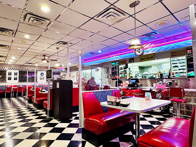 The checkerboard floor and cherry-red booths aren't trying to be retro—they're the real deal, preserved like a time capsule of American optimism.