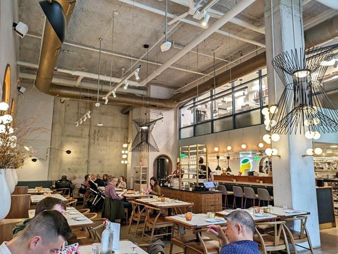 Industrial chic meets Italian warmth in Speck's airy dining room. Those sculptural light fixtures aren't just illuminating your pasta—they're conversation starters that rival the food.