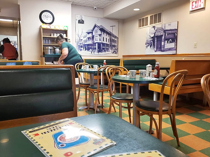 Step inside and the checkerboard floor, wooden chairs, and historic photos transport you to a simpler time when conversation mattered more than Wi-Fi passwords.