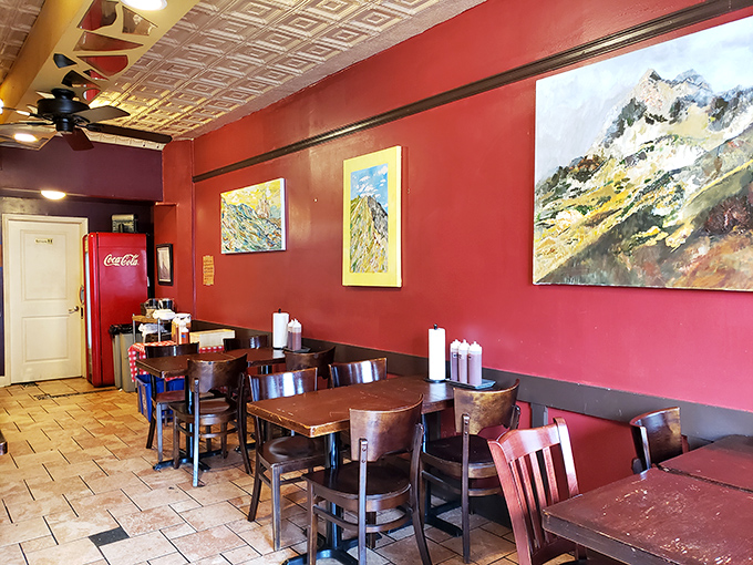 Red walls and local artwork create an unpretentious atmosphere where the food, not the frills, takes center stage.
