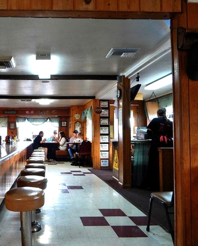 Classic counter seating with spinning stools invites solo diners to enjoy the show – breakfast theater at its finest with front-row tickets.