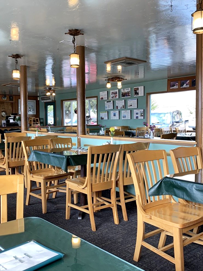 Simple wooden chairs and aqua tablecloths set the unpretentious stage where seafood, not décor, rightfully becomes the star of the show.