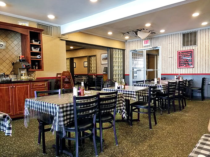 Black and white checkered tablecloths set the stage for culinary nostalgia. This isn't manufactured retro charm—it's the real deal, earned through decades of service. 