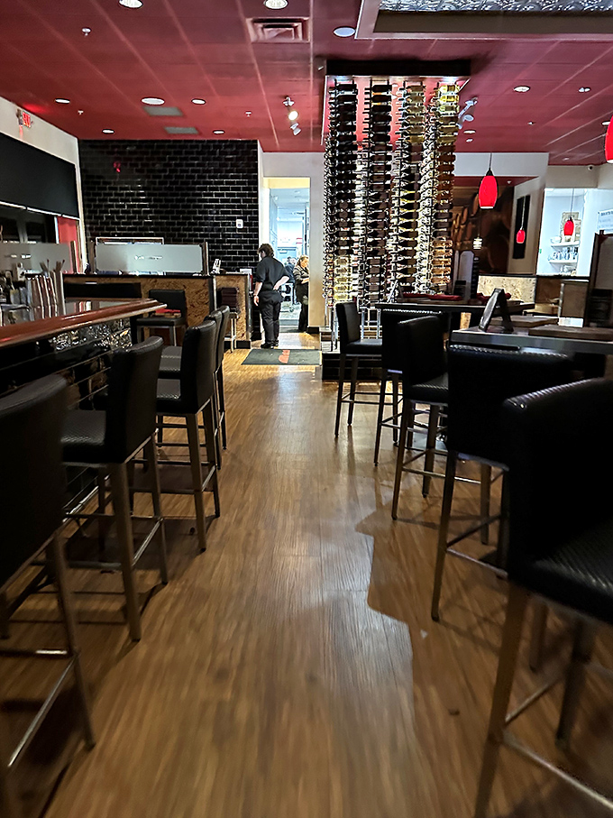 Where wine meets design – PRIME's interior marries modern elegance with steakhouse warmth. That floor-to-ceiling wine display isn't just storage, it's art.