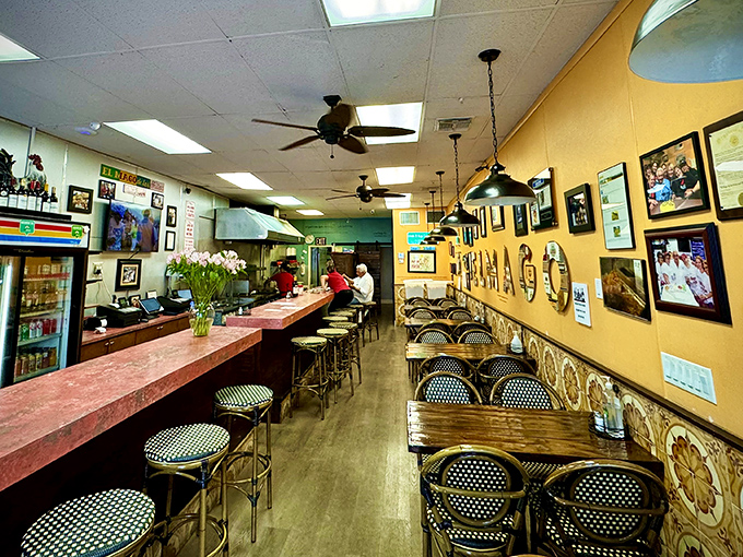 Yellow walls adorned with memories and a counter where strangers become friends. This isn't just dining—it's Miami's living room.