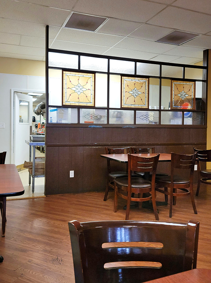 Vintage stained glass dividers add character without pretension. This isn't designer ambiance—it's the real deal, where conversations matter more than Instagram opportunities. 