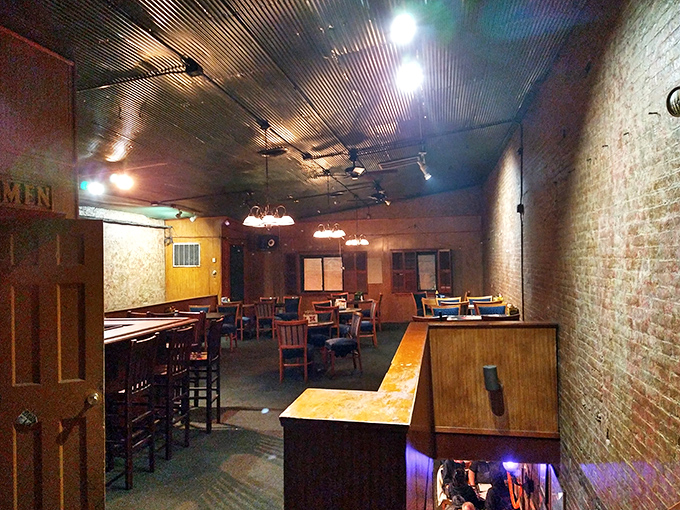 Step inside and time stands still. Exposed brick walls, tin ceiling, and warm wooden furnishings create the kind of authentic coziness money can't manufacture.