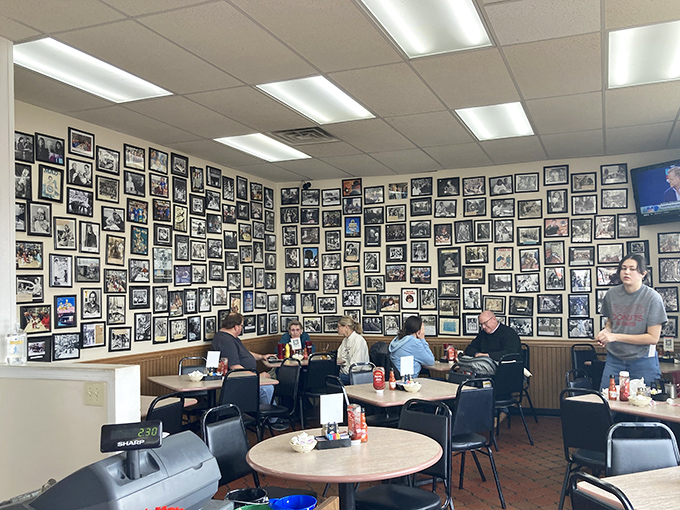Wall-to-wall memories frame every meal here. This photo gallery isn't curated by an art director—it's a genuine community scrapbook spanning decades.