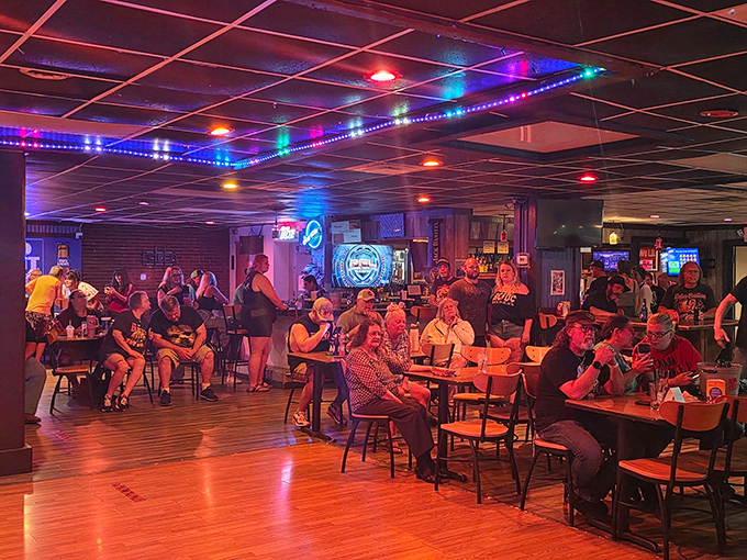 Friday night at The Backroom—where colorful lights, cold drinks, and the promise of that famous chicken wrap turn strangers into friends.
