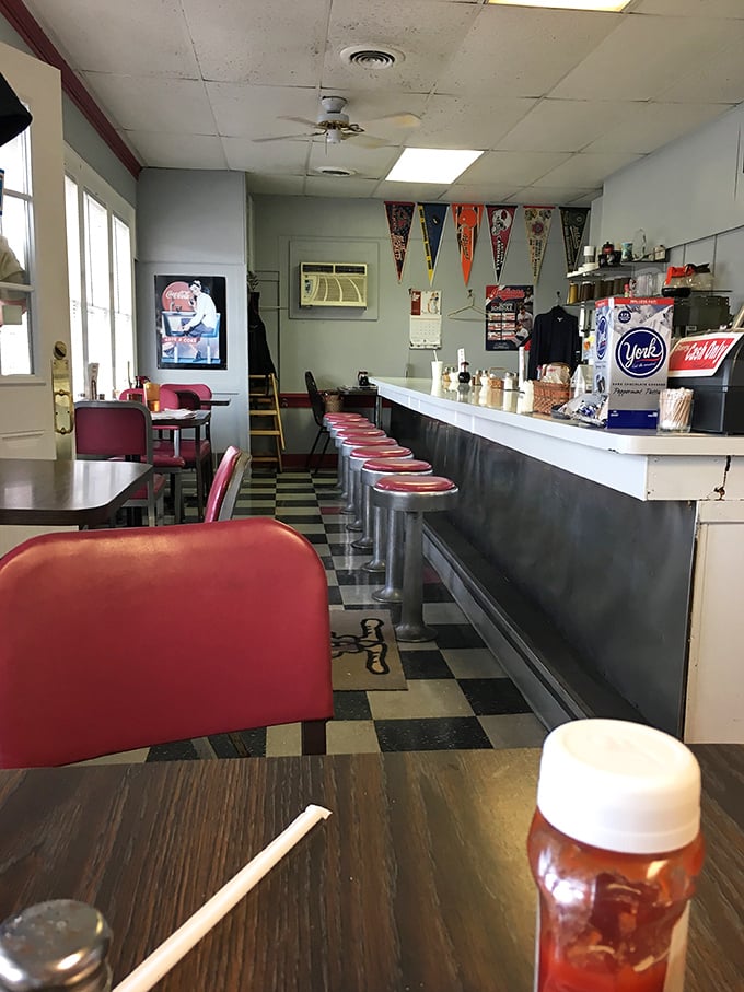 Classic diner perfection with red vinyl stools that have witnessed thousands of morning conversations and checkered floors that scream "authentic American breakfast."