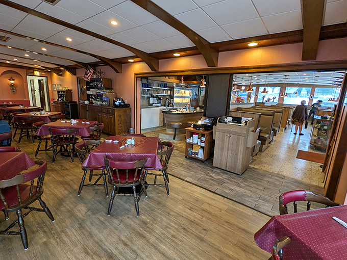 Burgundy chairs and wooden beams create that perfect diner atmosphere—where calories don't count and coffee refills are practically mandatory.