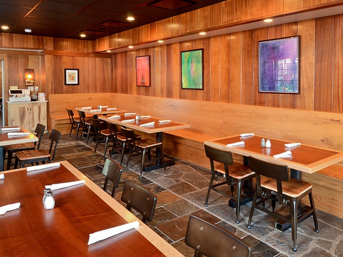 Warm wood paneling and simple, sturdy furniture create a dining room that says, "We're serious about the food, not the frills." The perfect backdrop for barbecue bliss.